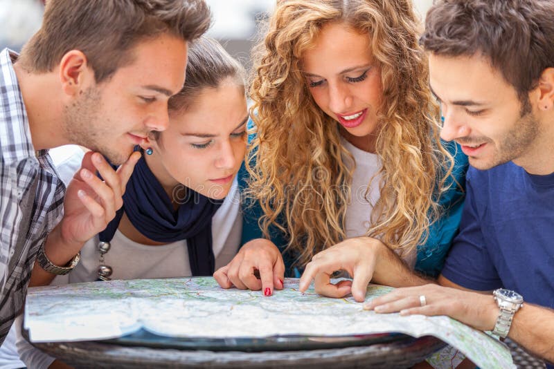 Tourists Looking at Map stock image. Image of people - 28093237