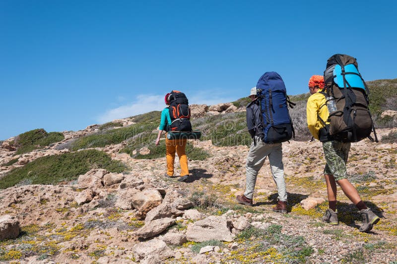 Group of Tourists with Large Backpacks are on Road Sea Editorial Photo ...