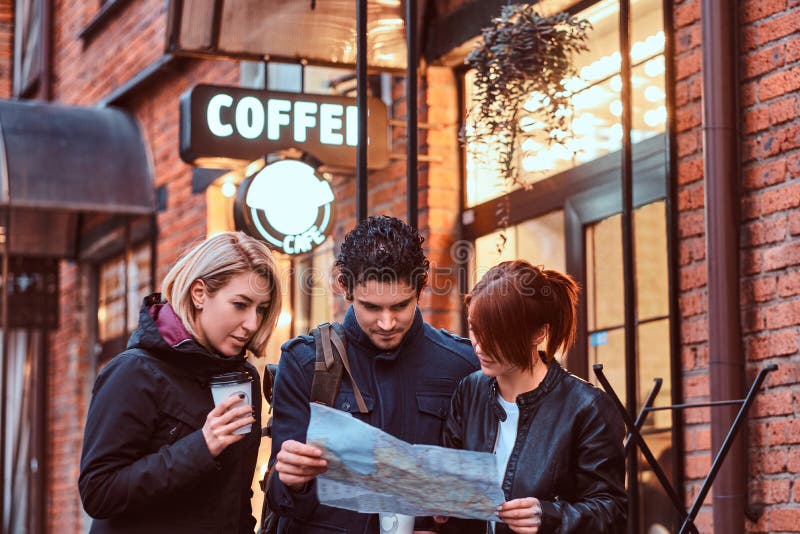Group of Tourists Searching Place on the Map Stock Image - Image of ...