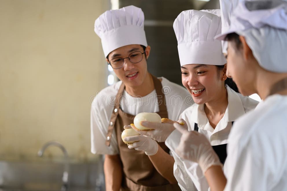 Group of Trainee Chefs Discussing Ingredients while Practicing Culinary ...