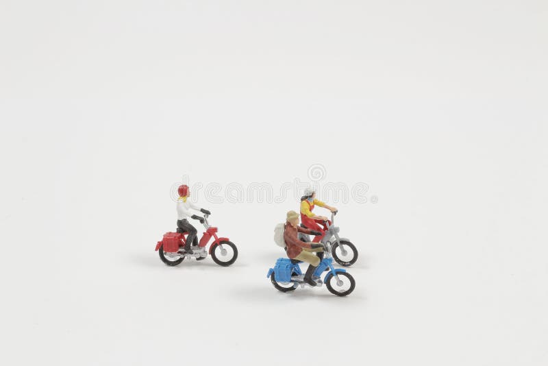 A Group of Traveler Miniature People Figures Ride Motorcycle Stock ...
