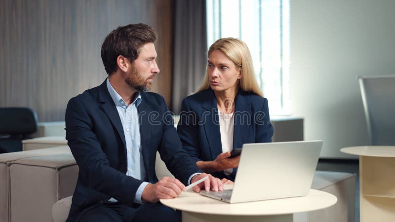 Business Partners in Formal Clothes Sitting at Office Desk and ...