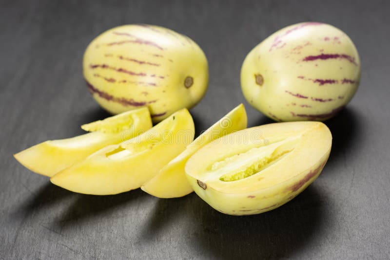 Fresh Striped Pepino Melon on Grey Stone Stock Photo - Image of cream ...