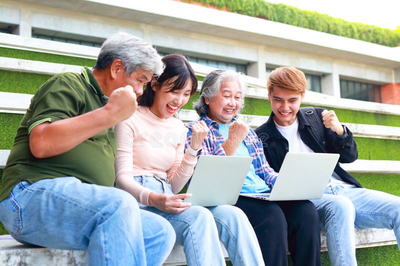 Group of University Students of Different Ages Smiling Happily Using ...