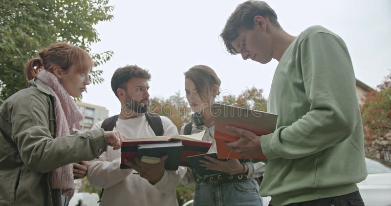 University Students Comparing Notes after Exam Stock Video - Video of ...