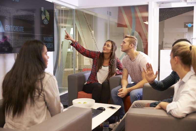 Group of University Students Discussing Project Together Stock Photo ...
