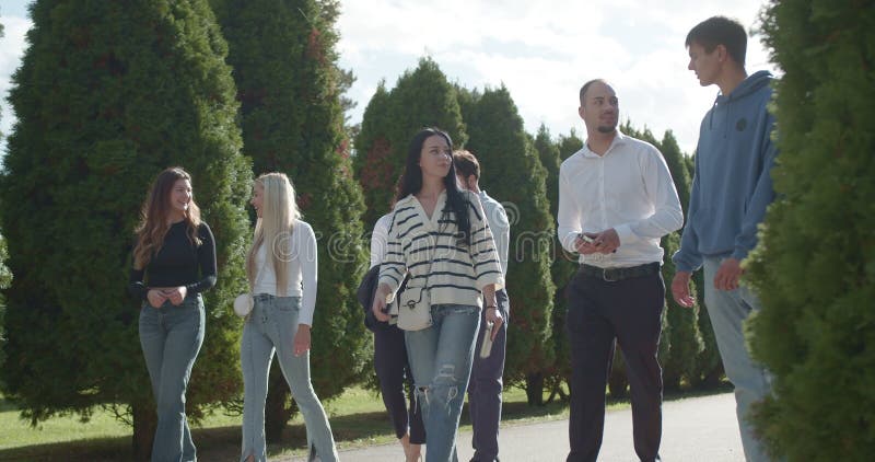 Group of University Students, Friends, Having a Conversation while ...