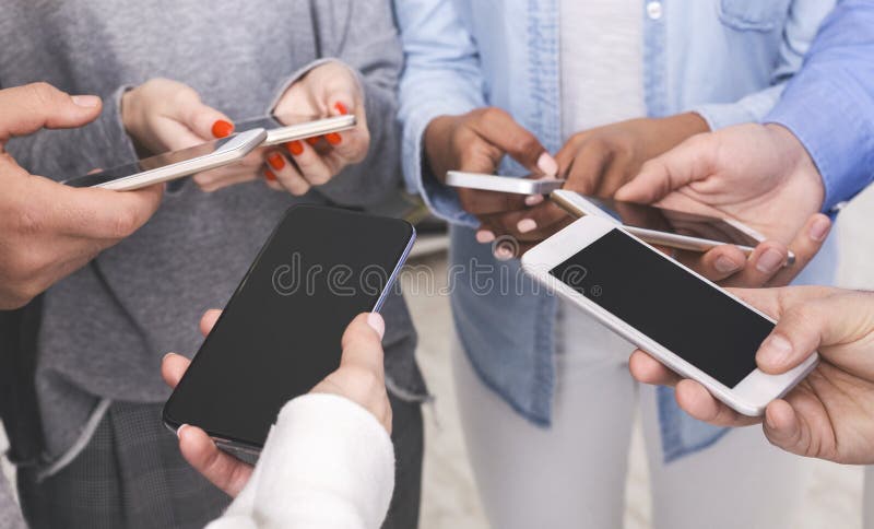 Group of Unrecognizable Friends Using Smartphones with Black Screen ...