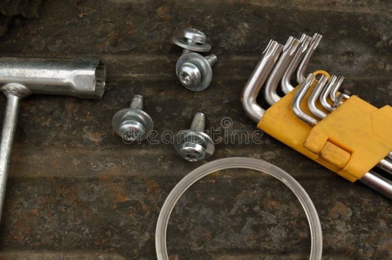 A Group of Used Mechanical Tools on a Metallic Dark Background. with ...