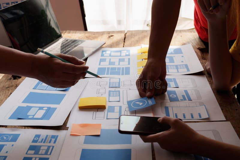 Group of Ux Developer and Ui Designer Brainstorming about App Interface ...