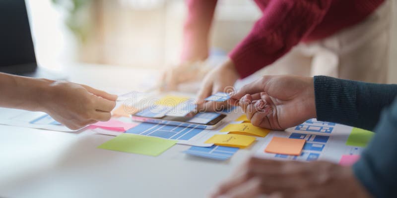 Group of UX UI or Designers Working To Create Content of Mobile ...