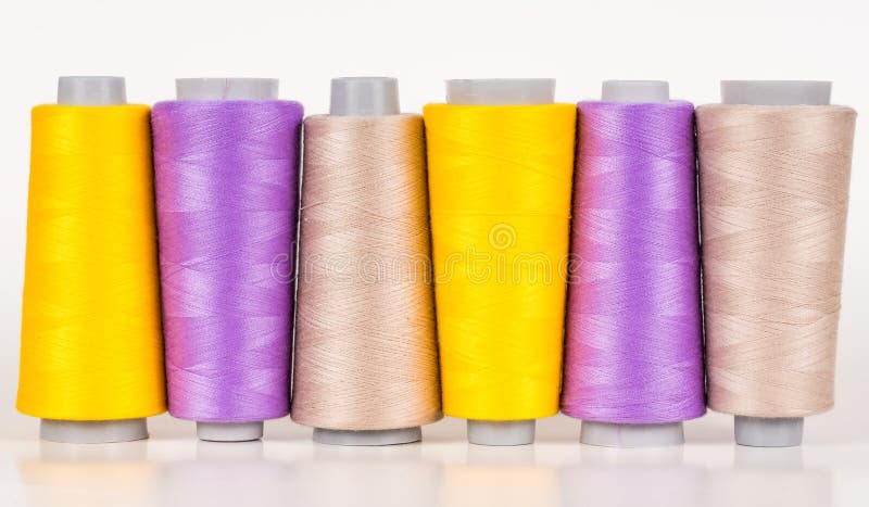 Vary colored thread coils stock photo. Image of bobbin - 103282248