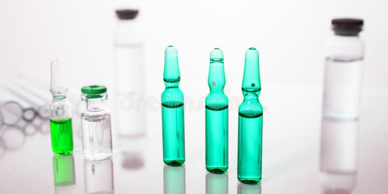 Group of Vials with Medication on Blue Methacrylate Table Stock Image ...