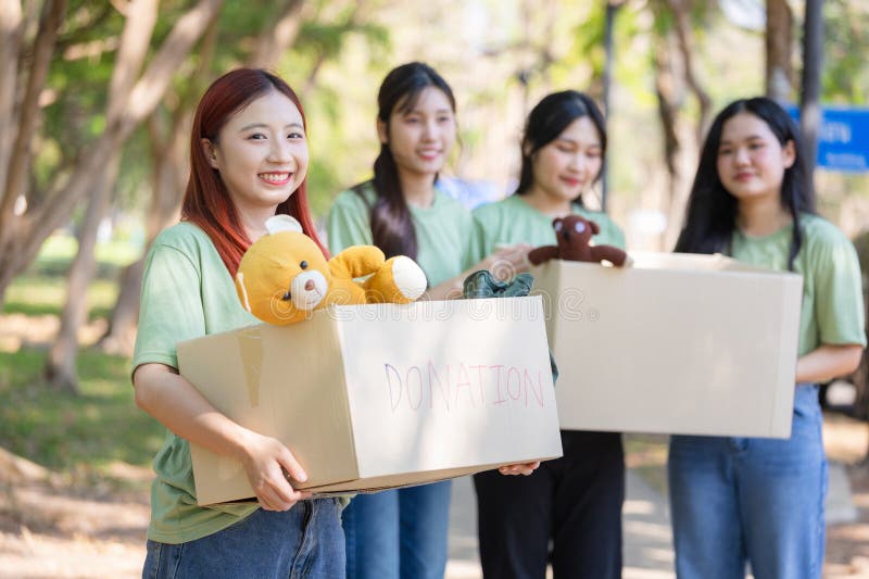 Group of Volunteers Helping the Community with Donations, Smiling Volunteers Engaged in Donation ...