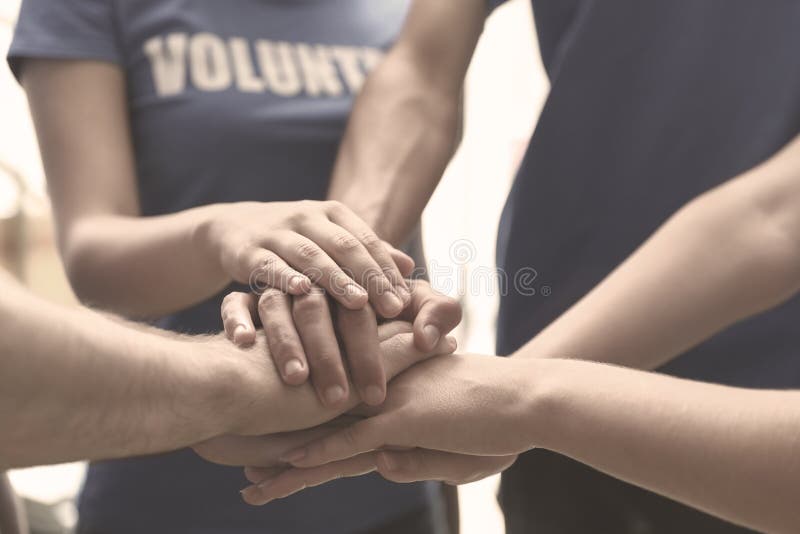 Group of Volunteers Joining Hands Together, Closeup. Black and White ...