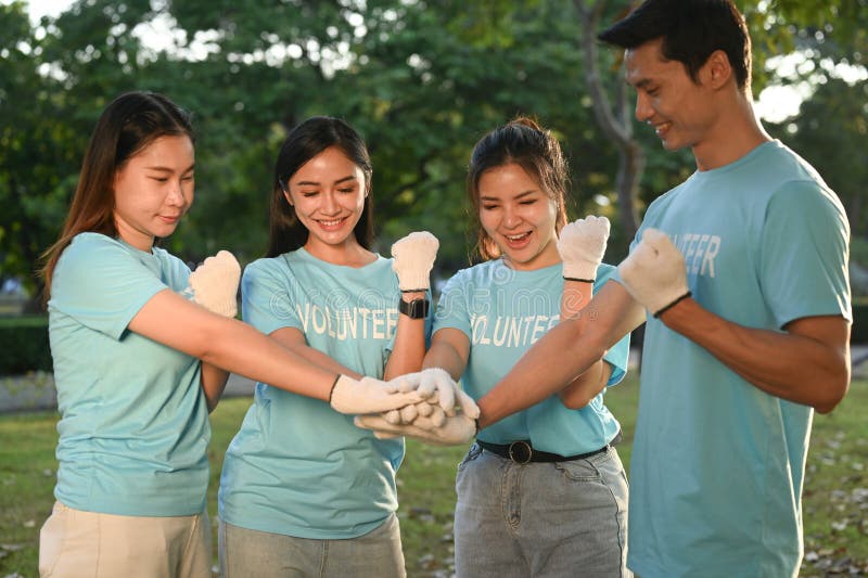 Group of Volunteers Stacking Their Hands Together Showing the Power of ...