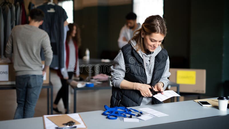 Group of Volunteers Working in Community Charity Donation Center. Stock ...