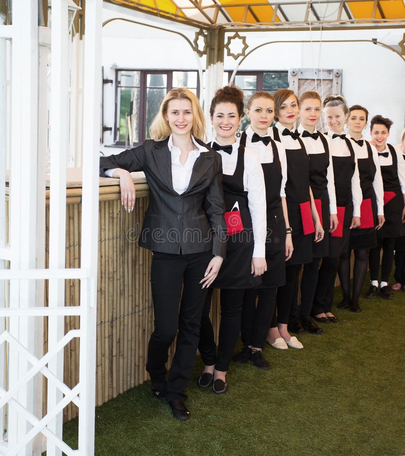 Group of Waiters at a Prestigious Restaurant Standing in the Col Stock ...