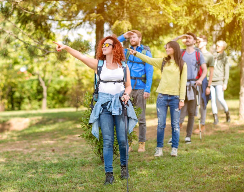 Group of Walkers in Forest Pointing Something Stock Photo - Image of ...