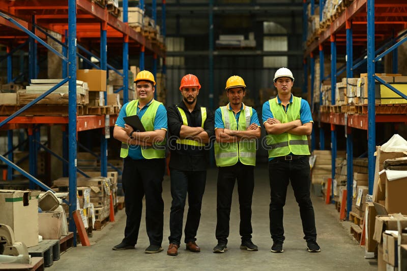 Group of Warehouse Workers in Hardhat and Reflective Jacket Standing ...