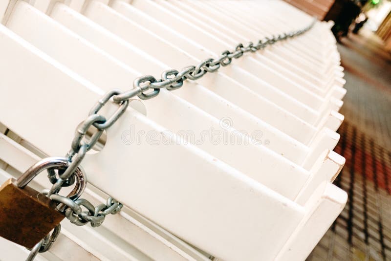 Group of White Chairs Tied with a Chain and Padlock Stock Image - Image ...