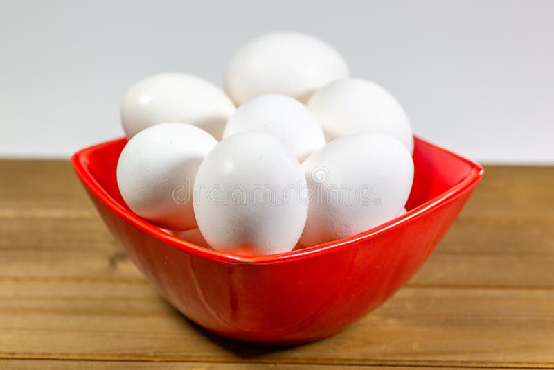 A Group of Eggs Inside a Deep Red Bowl Waiting for the Chef To Use Them ...