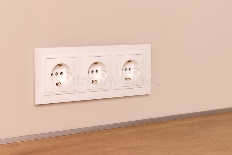 Electrical Outlets on Beige Wall Stock Photo - Image of home, room ...