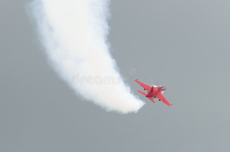 Group of White Fighter Jet Airplane with a Trace of White Smoke Against ...
