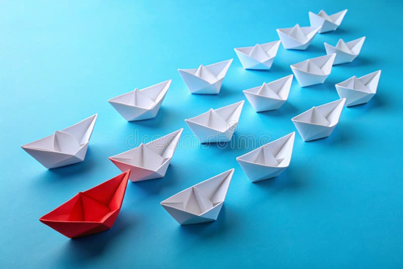 Group of White Paper Ships with One Red Ship Pointing in Different ...