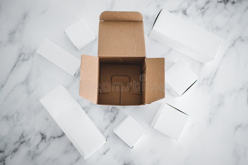 Group of White Plain Delivery Parcels with an Open and Empty One in the ...