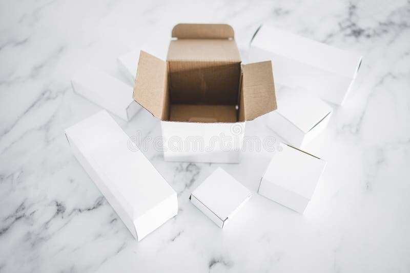 Group of White Plain Delivery Parcels with an Open and Empty One in the ...