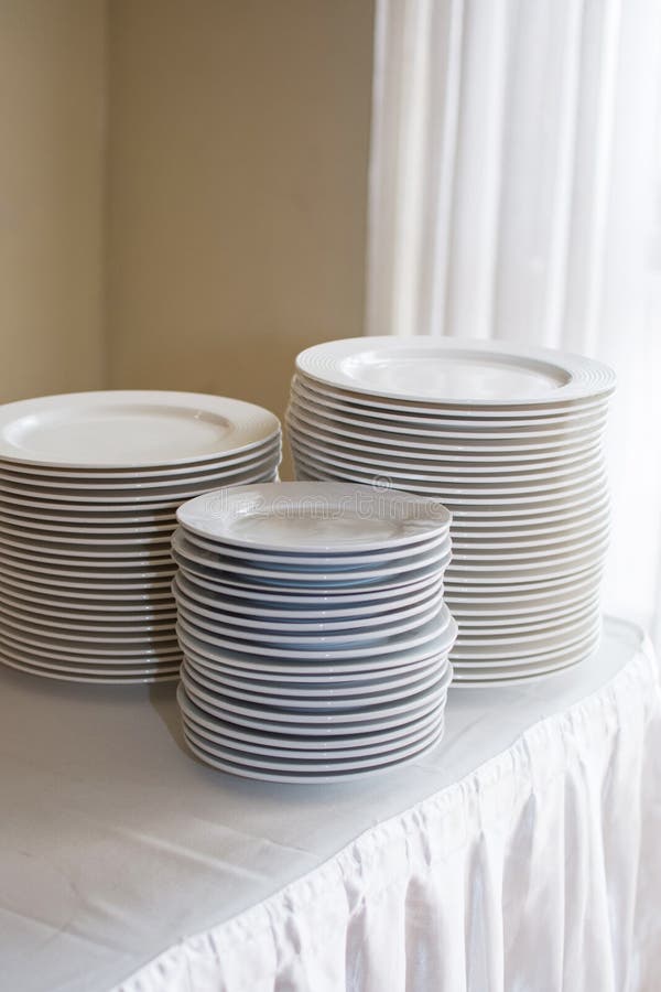 Group of White Plates Stacked Together in a Hotel Stock Image - Image ...