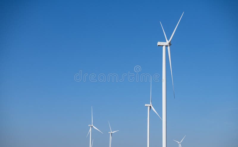 A Group of Wind Turbines Against Blue Sky, Wind Energy. Wind Power ... A Group of Wind Turbines Against Blue Sky, Wind Energy. Wind Power ...