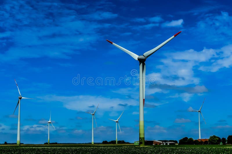 A Group of Wind Turbines are Standing in a Field Stock Image - Image of ...