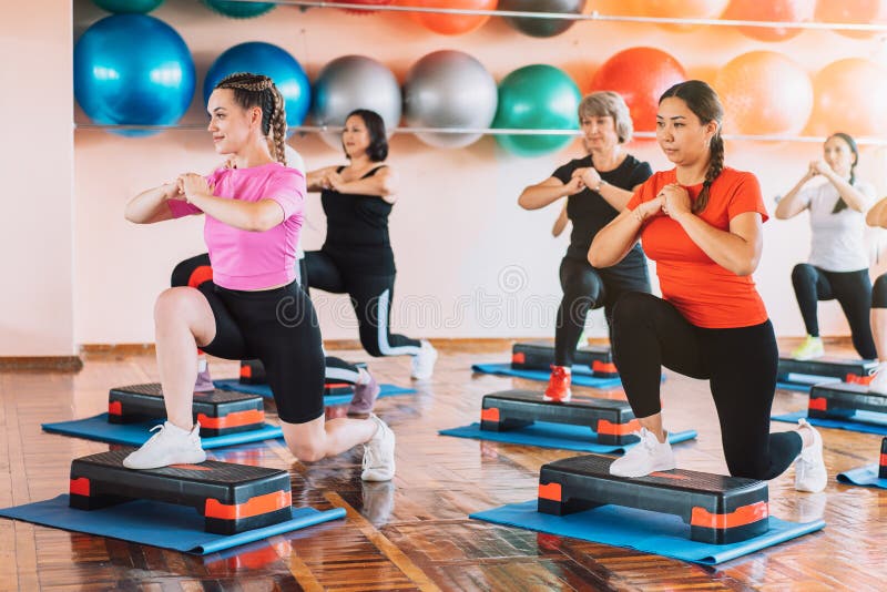 Group of Women Doing Step Aerobics Indoors Stock Photo - Image of ...