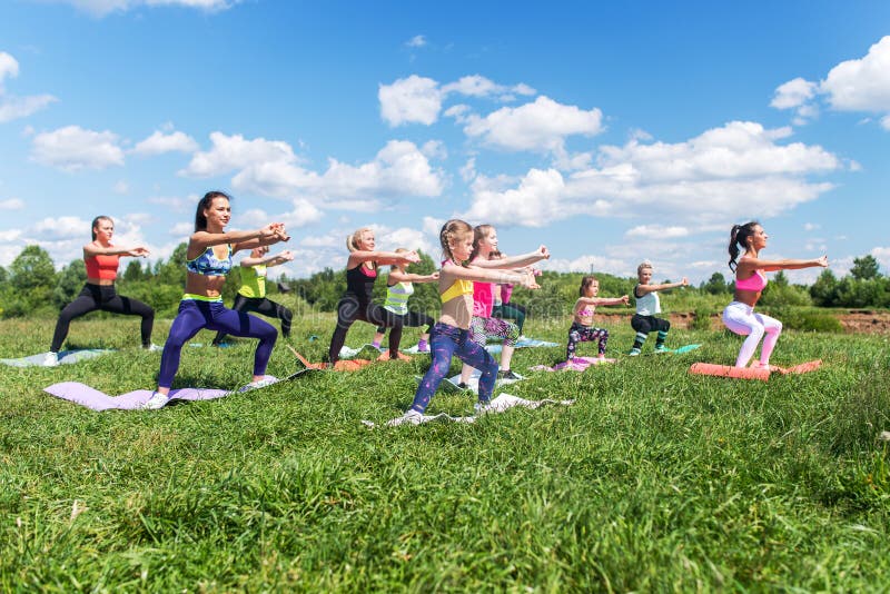 Group of Women Exercising and Doing Squats at Boot Camp. Stock Image ...