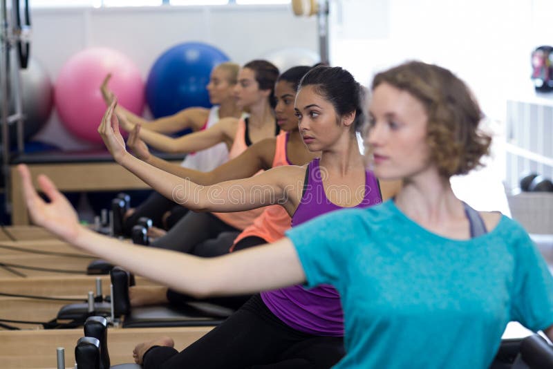 Group of Women Exercising on Reformer Stock Image - Image of lifestyle ...