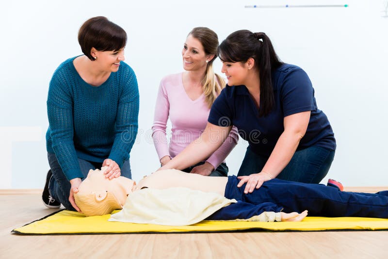 Group of Women in First Aid Course Stock Image - Image of mouthtonose ...