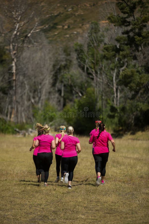 Group of Women Jogging Together in the Boot Camp Stock Photo - Image of ...