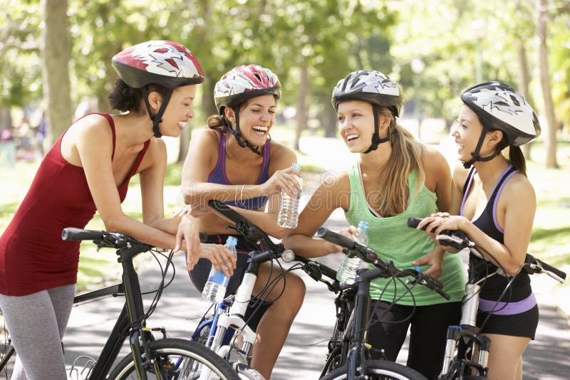 Group of Women Resting during Cycle Ride through Park Stock Image ...