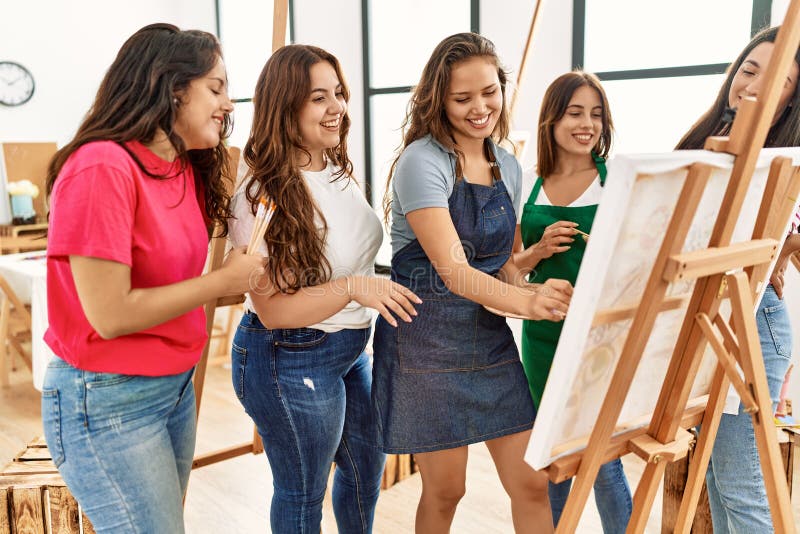 Group of Women Smiling Happy and Looking Draw of Partner Standing at ...