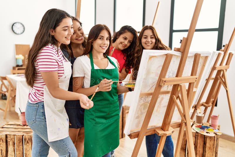 Group of Women Smiling Happy and Looking Draw of Partner Standing at ...