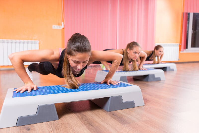 Group of Women Strengthening Cores in Step Class Stock Image - Image of ...