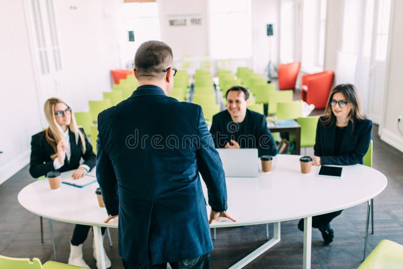 Group of Work Business Colleagues Talking about the Business Plan at ...