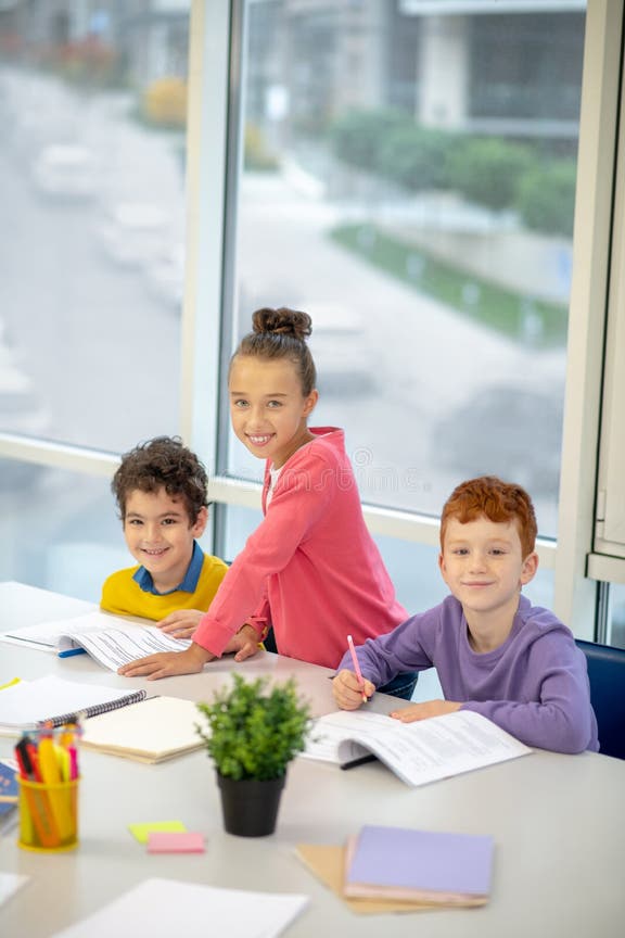 Three Happy Kids Doing Group Task Together Stock Image - Image of ...