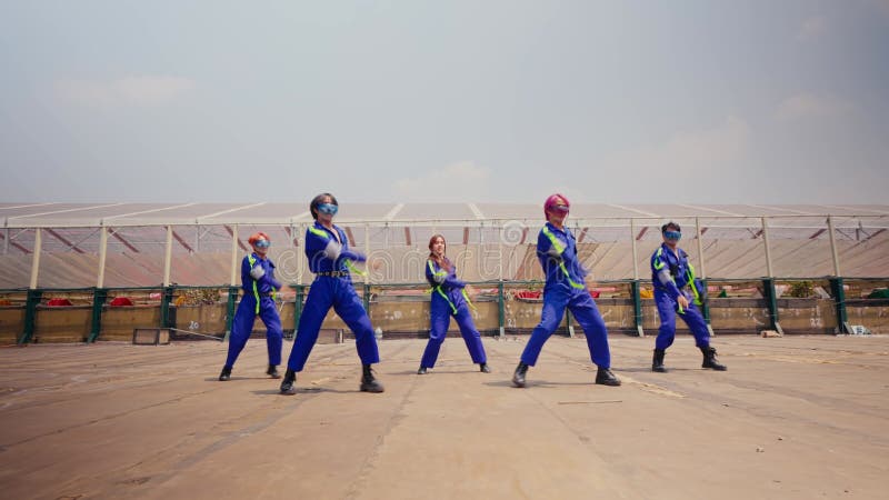 Diverse Group of Workers in Blue Uniforms Dancing Confidently on ...