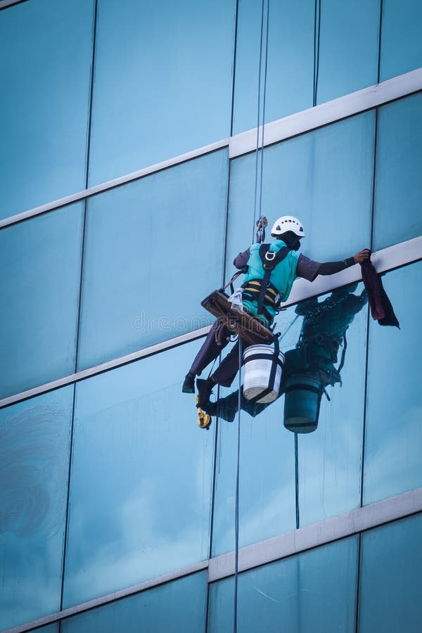 Group of Workers Cleaning Windows Service on High Rise Building Stock ...