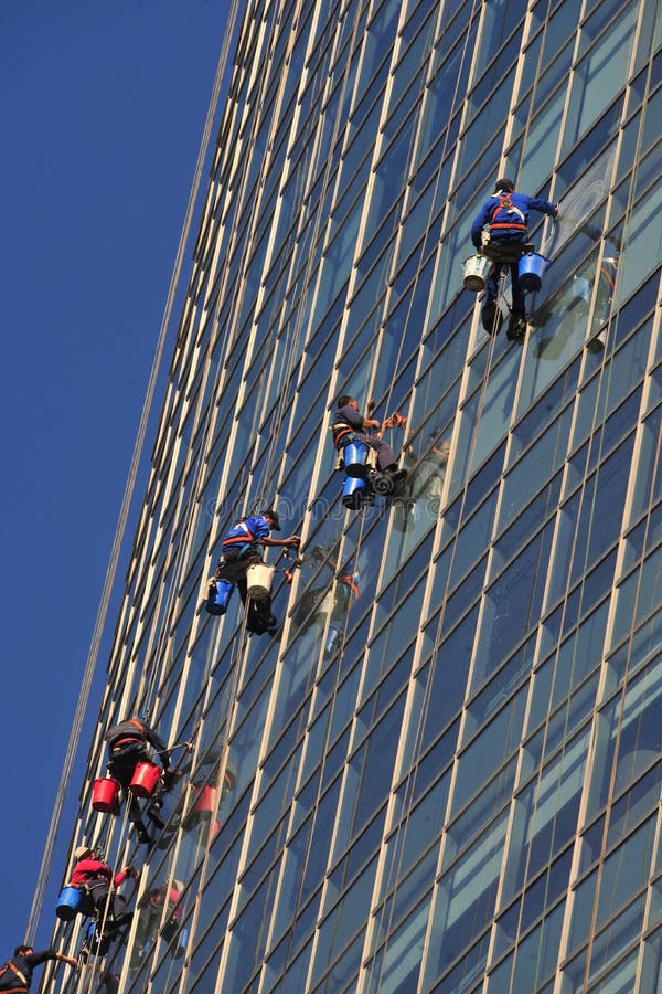 Group of Workers Cleaning Windows Service on High Rise Building ...
