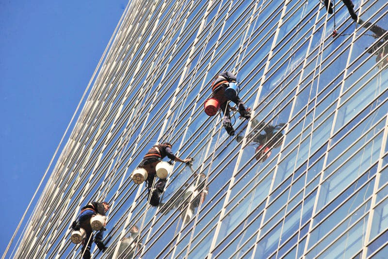 Group of Workers Cleaning Windows Service on High Rise Building ...