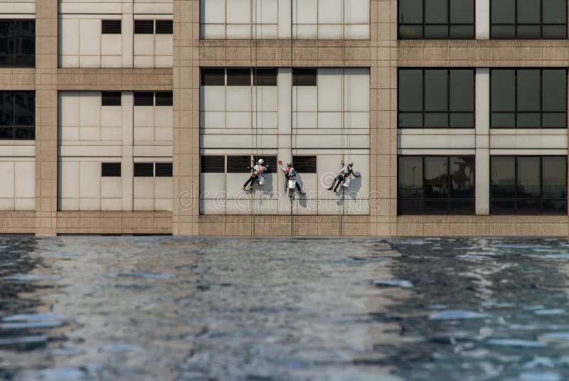 Group of Workers Cleaning Windows Service on High Rise Office Building ...